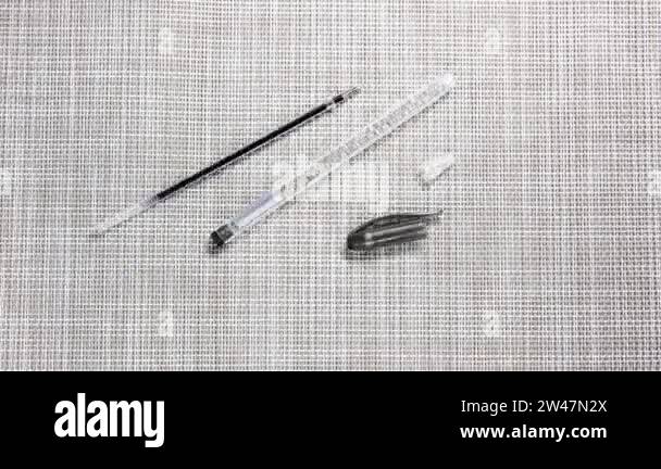 Stop motion animation. Picking up and twisting a ballpoint pen. A rod ...