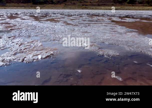 The bottom of a dying estuary, lake. Self-precipitating salt covers ...