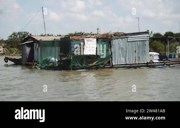 Traditional Vietnamese ferry boat taking people and their bicycles ...