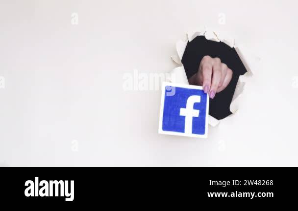 facebook logo influencer hand mobile app hole Stock Video Footage - Alamy