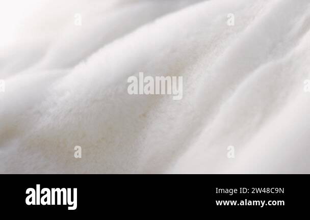 White fluffy fur coat texture, warm winter clothing, luxury textile and ...