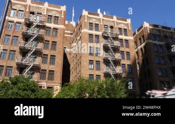 Fire escape ladder outside residential brick building in San Diego city ...