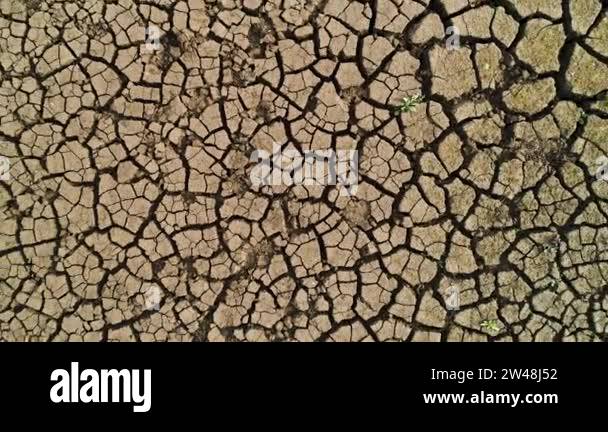 Aerial top view of the ground during the dry season. Shot. Drought ...