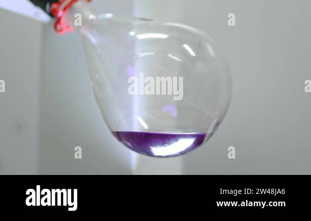 Glass bulb rotates in a laboratory evaporator. Scientific medical ...