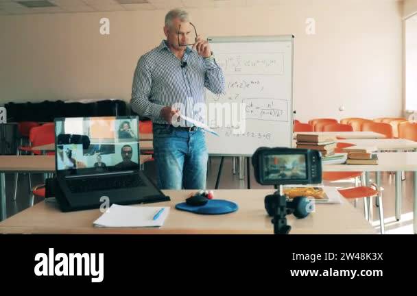 Male teacher is explaining formulas for online students. Online learning, online training ...