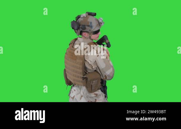 Fully Equipped Solder Holding Assault Rifle and Standing looking to the ...