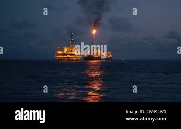 FPSO tanker vessel near Oil Rig platform. Offshore oil and gas industry ...
