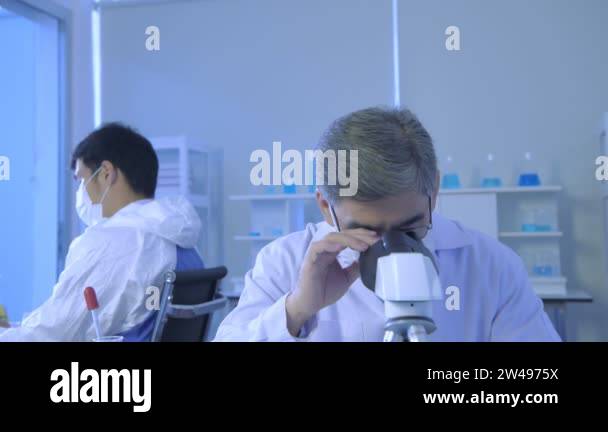 Research concept of 4k resolution. Asian scientists are examining the ...