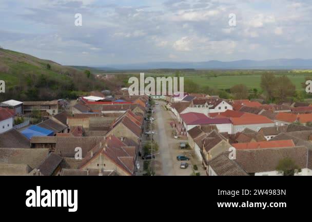a Christian church with two towers in a small village at the foot of ...