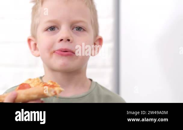 Portrait blonde boy Eating cheese Pizza Smiling close up .Happy Child ...