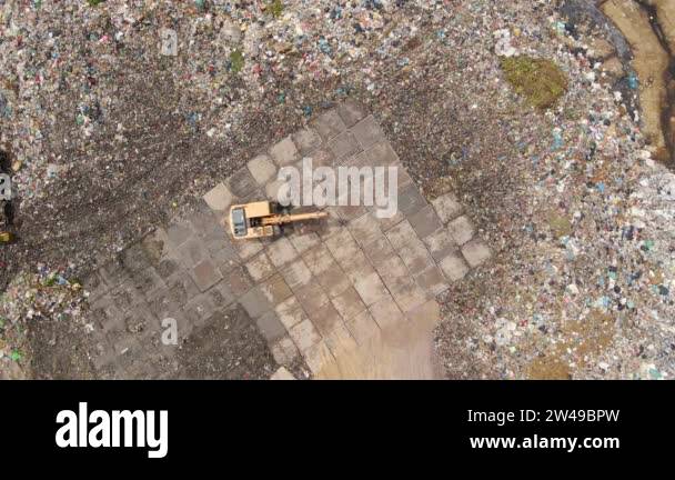 Aerial top view video of a solid waste landfill. City waste treatment ...