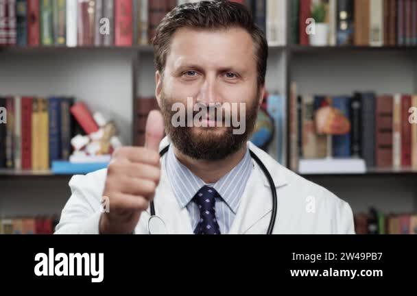 Doctor thumb up. Friendly male doctor in white coat and stethoscope in ...
