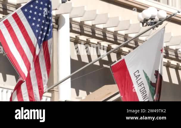 Flags of California and United States waving on flagpole in Gaslamp ...
