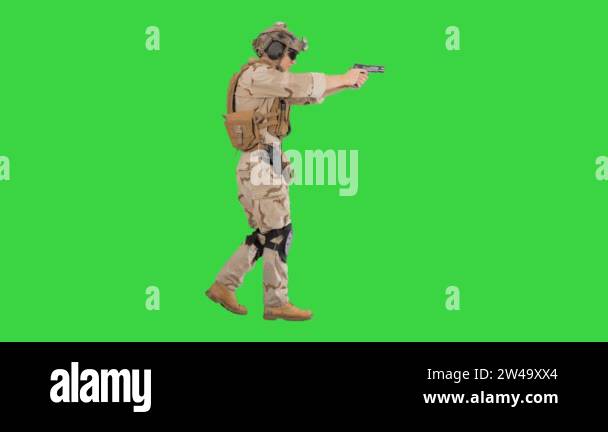 Special operations training Soldier walking and shooting from hand gun ...