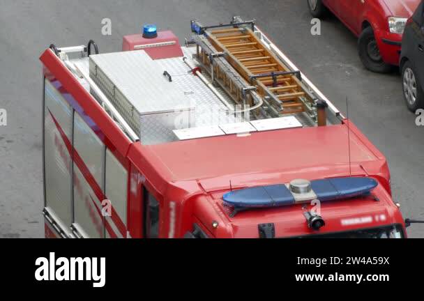 Top view of blinking blue fire truck siren, red fire engine arriving to ...