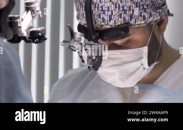 Two surgeons working at the operating clean room. Action. Two male ...