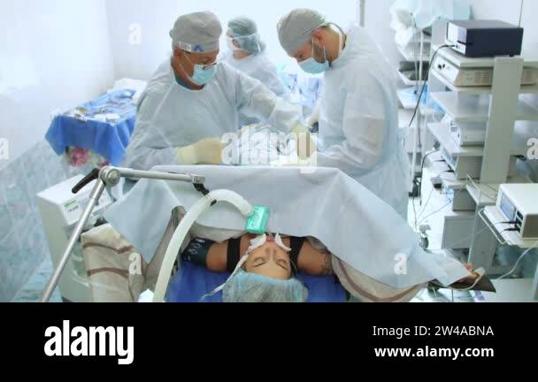 abdominal liposuction. surgery. the surgeon pumps out the fat through a ...