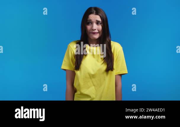 Guilty confused woman making oops, im sorry expression. Girl long hair ...