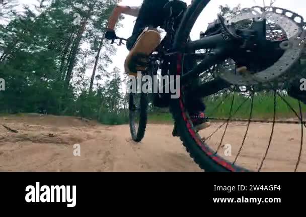 Backside view of a man cycling on a bmx in the forest Stock Video ...