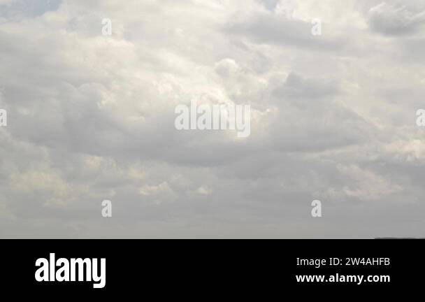 Building motions clouds. Puffy fluffy white clouds sky time lapse. slow moving clouds. B Roll ...