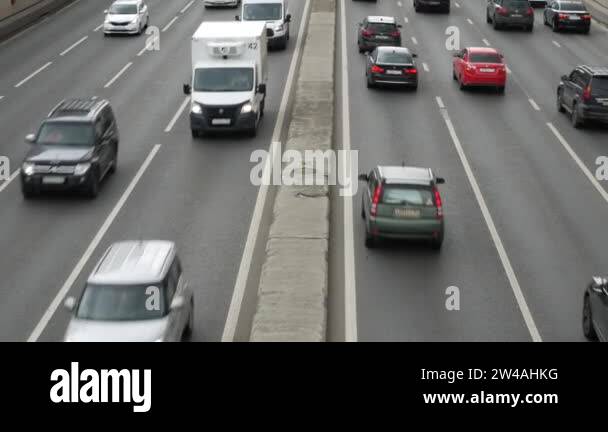 Cars drive in dense stream along Garden Ring in capital city. Tunnel at ...