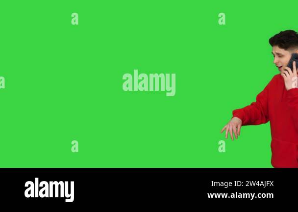 Casual hip-hop man walking and talking on the phone and dancing on a ...