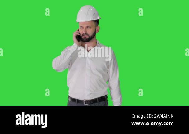 Architect talking by the phone while walking on a Green Screen, Chroma ...