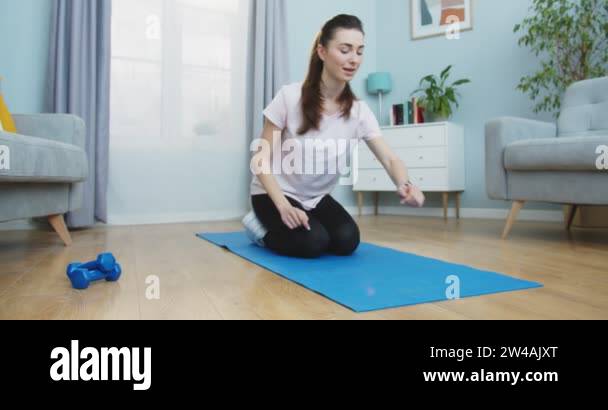 Middle side plan of young girl looking at watch and start to do fitness ...
