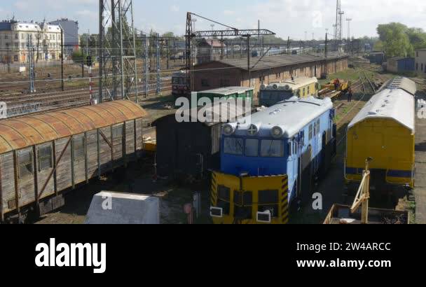 Workers Distantly Men in Orange Workwear Are Climbing to the Locomotive ...