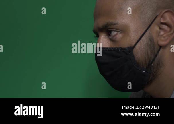 Adult Male Wearing Face Mask Looking Forwards. Left Side View, Green ...