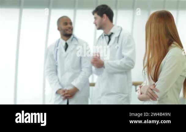Three confident doctor examining x-ray snapshot of lungs in clinic ...