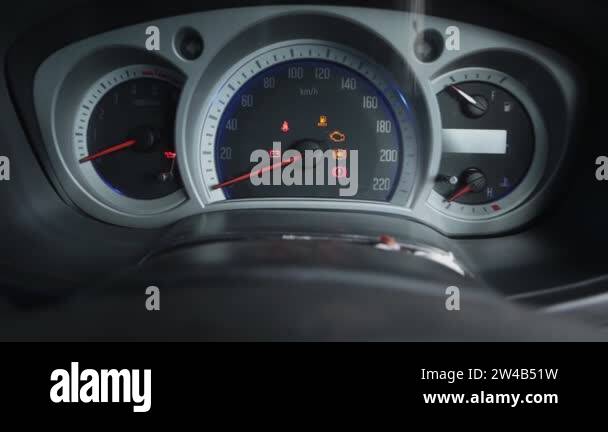 Handheld Shot Car Warning Light Symbols and Indicators on Car Dashboard ...