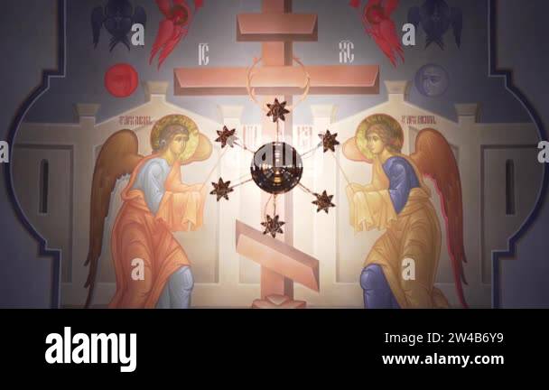 A drawing of angels on the ceiling in the church. Lamp. A golden ...