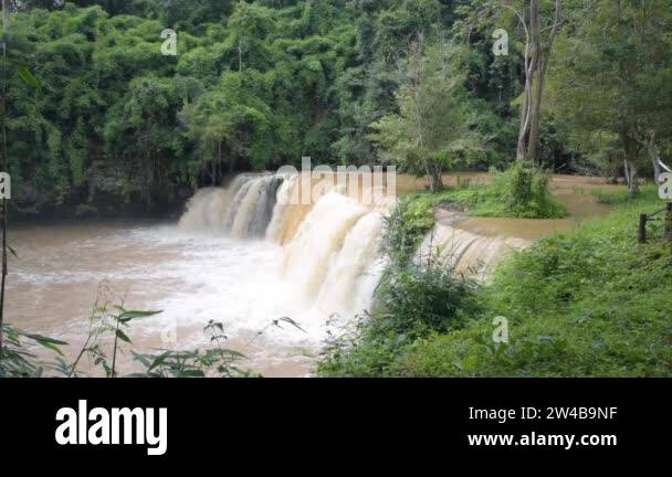 The waterfalls are yellow in color because of heavy rains in the rainy ...