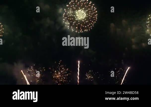 Golden big shiny fireworks with bokeh lights in the night sky. Glowing ...