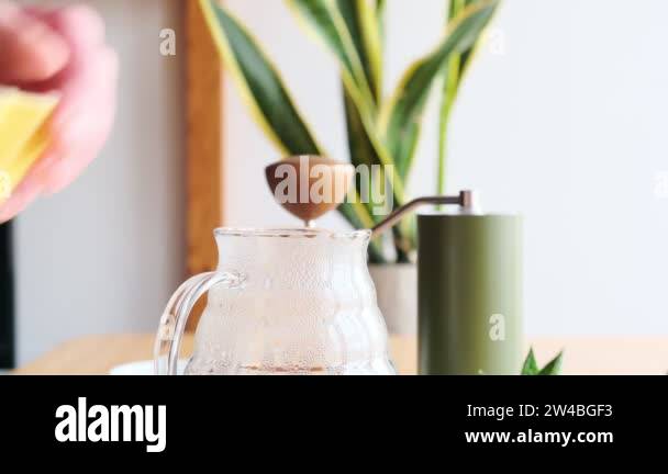 Making coffee. Speciality coffee at home. Barista pours water from the ...