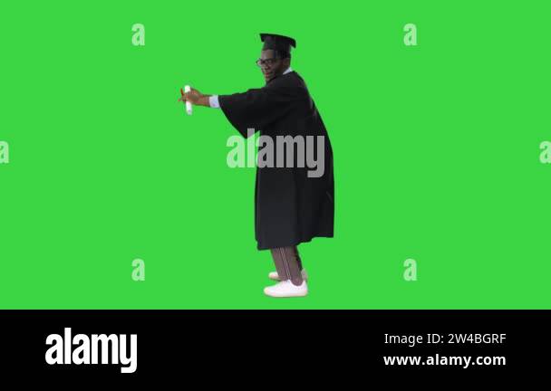 Excited african american male student in graduation robe dancing ...
