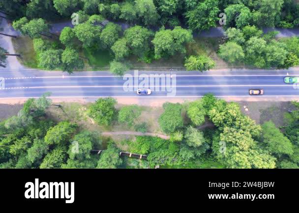Aerial view of highway in city. Cars crossing interchange overpass. Highway interchange with ...