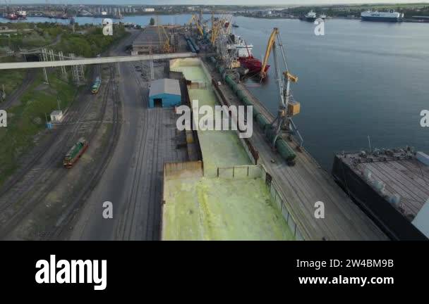 4K modern industrial port with containers from top or bird's eye view ...