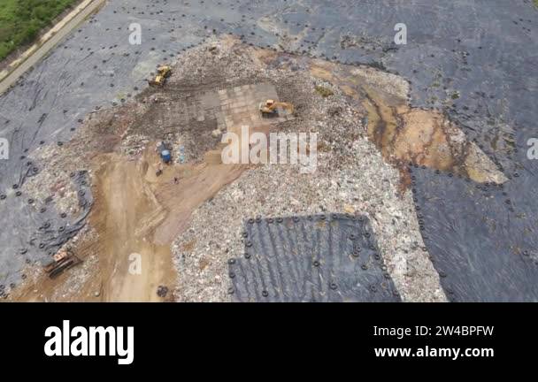 Aerial top view video of a solid waste landfill. City waste treatment ...