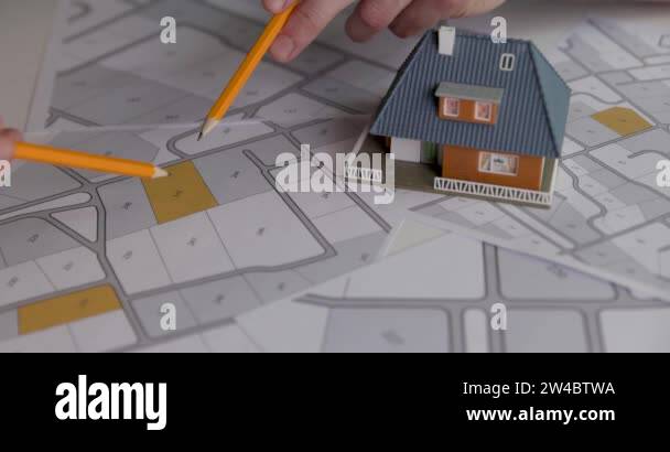 people discussing and choosing building plot for house construction on ...