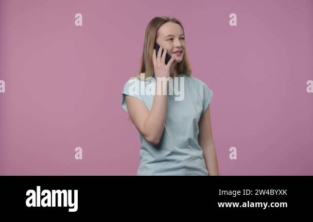 Portrait of a model with natural beauty talking for mobile phone and ...