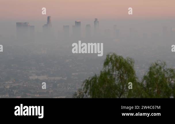 Highrise skyscrapers of metropolis in smog, Los Angeles, California USA ...