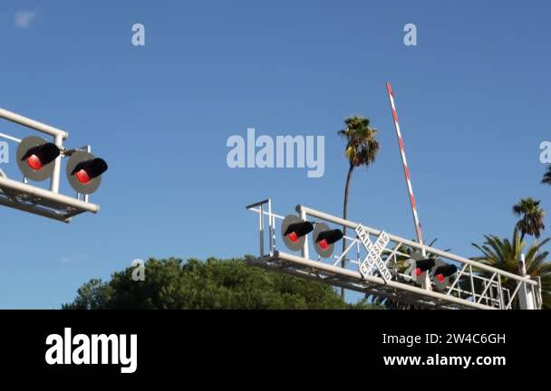 Level crossing warning signal in USA. Crossbuck notice and red traffic ...