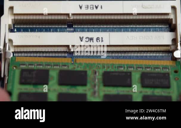 Inserting RAM into a laptop connector, laptop repair and maintenance at ...