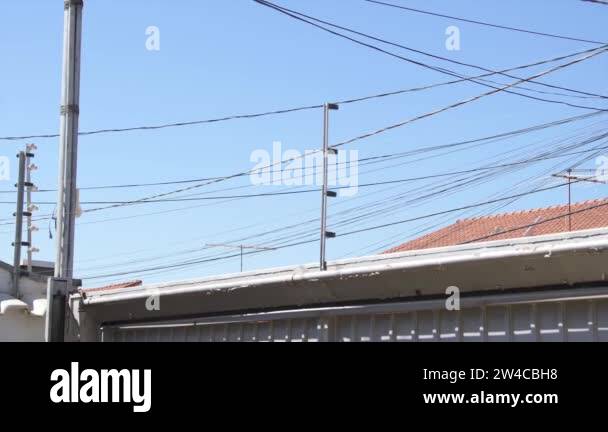 Electrical pole wiring of a residential area. Mess of light pole wires ...