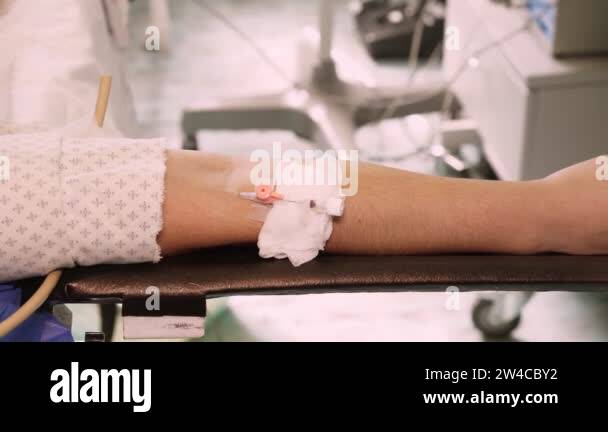 close-up. Peripheral venous catheter insertion in operation room ...