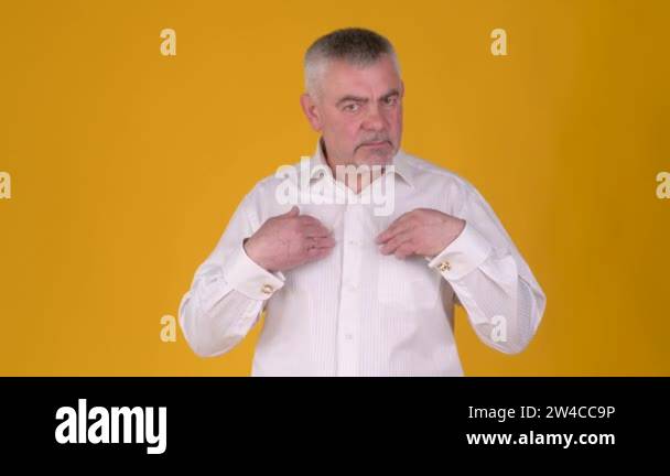 Attractive older man showing refusal gesture no, shaking his hands, ask ...