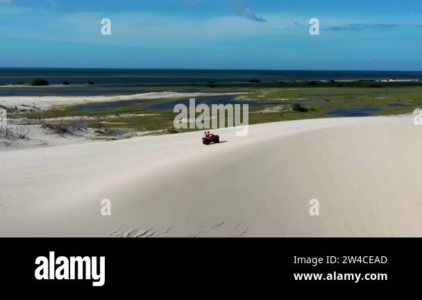 Riding a 4x4 offroad vehicle in the dunes waves, Jericoacoara, Ceara ...