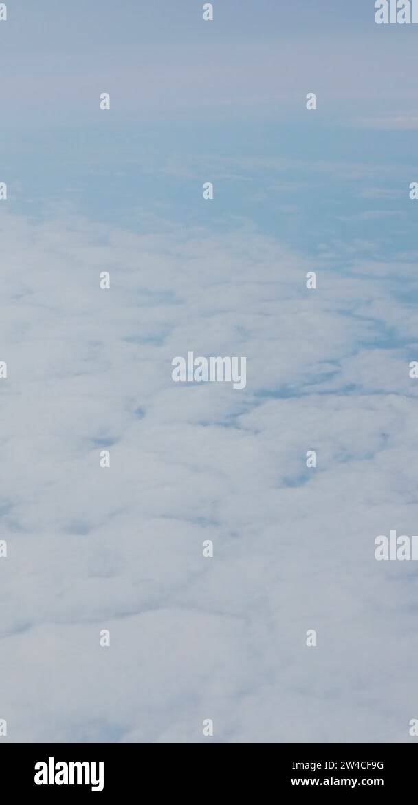 Airplane flight. Wing of an airplane flying above the clouds with ...